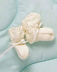 Crossover Knit Baby Booties Pattern | FaveCrafts.com
