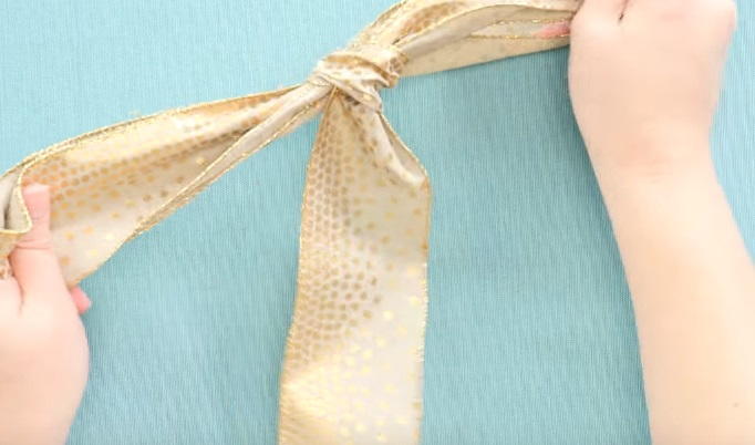 How to Tie a Simple Ribbon Bow Perfectly | FaveCrafts.com