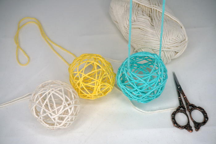 DIY Yarn Lanterns | FaveCrafts.com