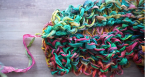 How to Arm Knit a Scarf [Video + Photo Tutorial] | FaveCrafts.com