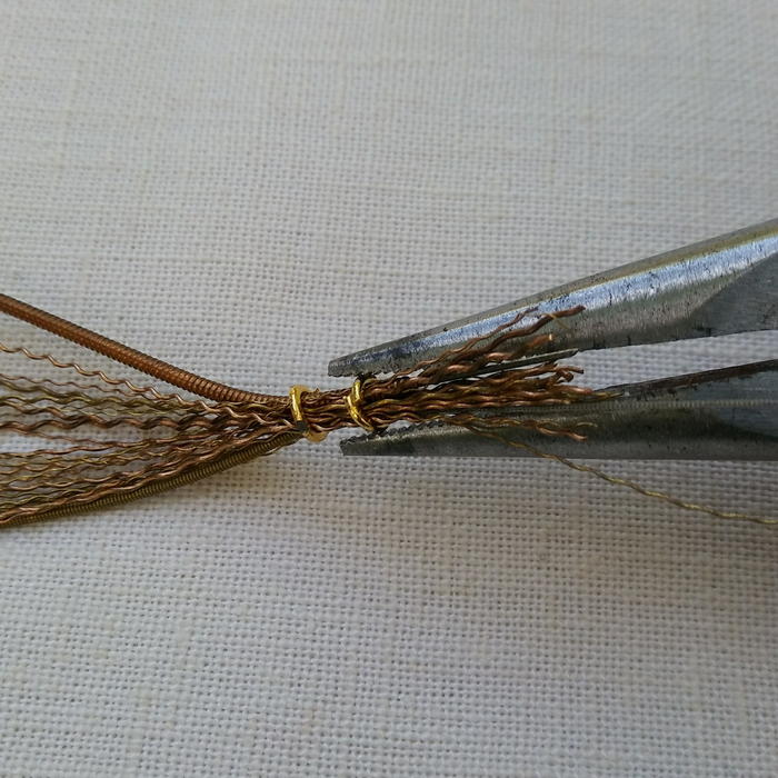 Upcycled Lily Sculpture Made From Used Guitar Strings | FaveCrafts.com