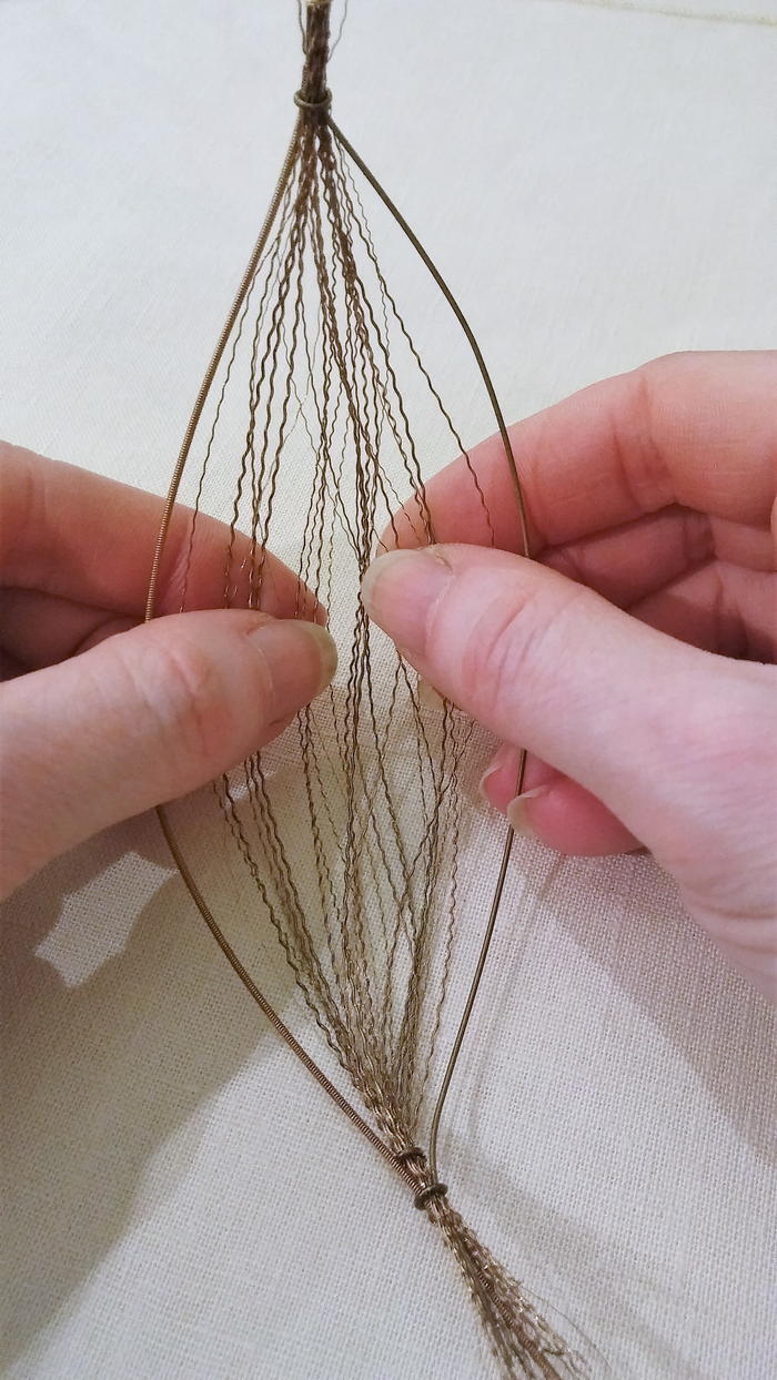 Upcycled Lily Sculpture Made From Used Guitar Strings | FaveCrafts.com