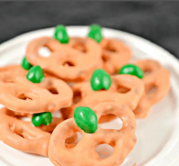 Easy Candy Coated Pretzel Pumpkins For Kids | FaveSouthernRecipes.com
