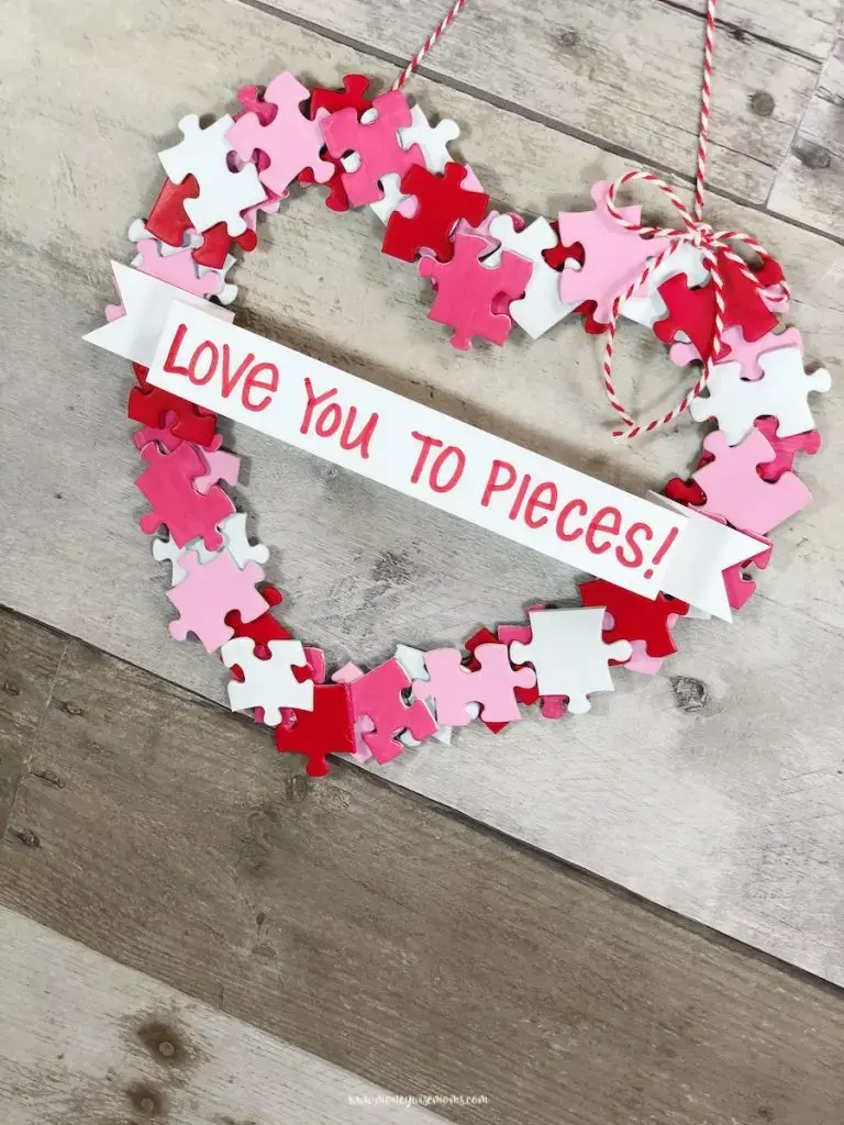 Puzzle Piece Valentine Heart Wreath | AllFreeKidsCrafts.com