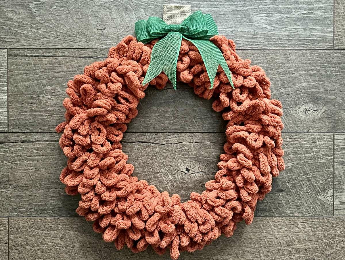 Yarn Pumpkin Wreath | AllFreeHolidayCrafts.com
