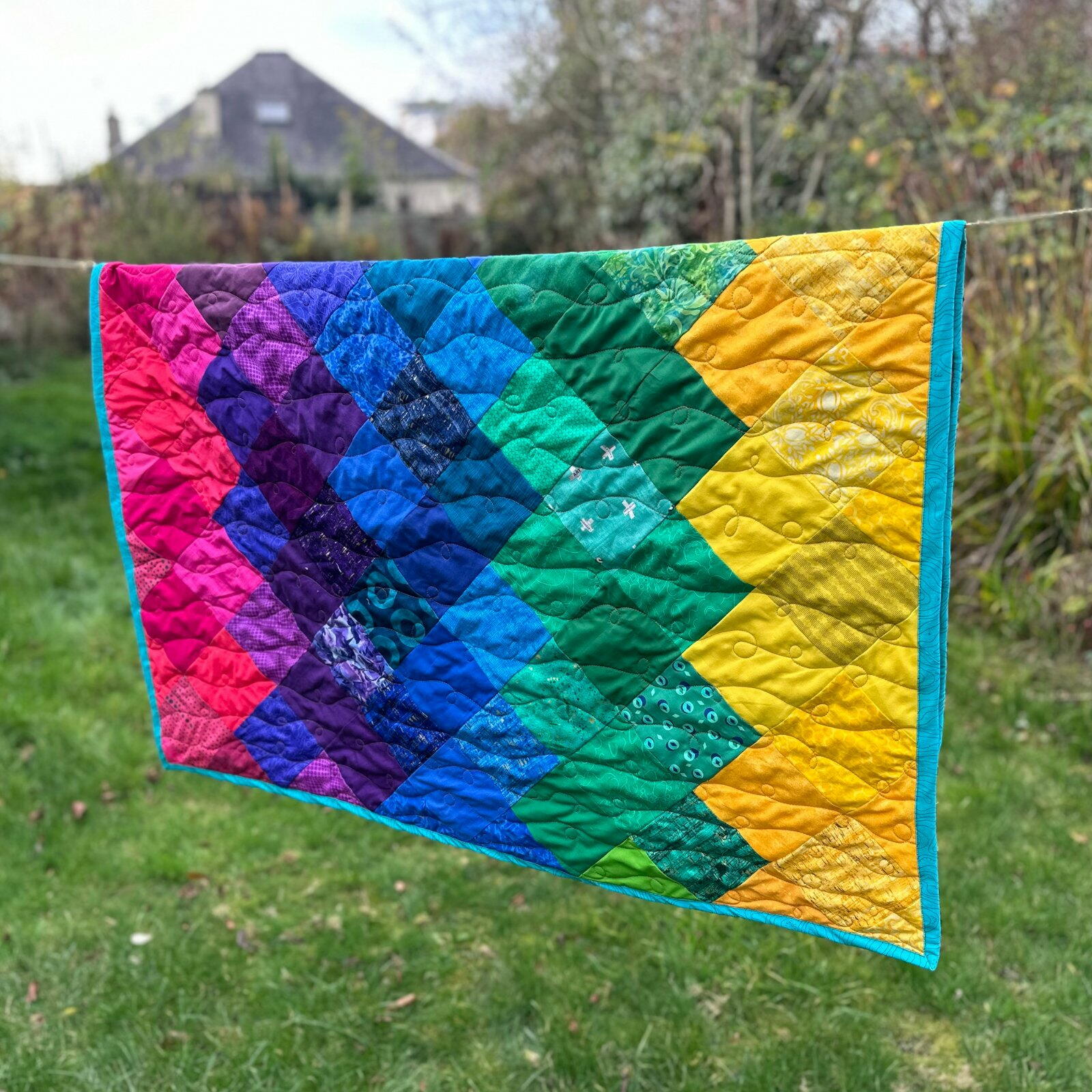 Easy Rainbow On Point Charm Pack Quilt | FaveQuilts.com